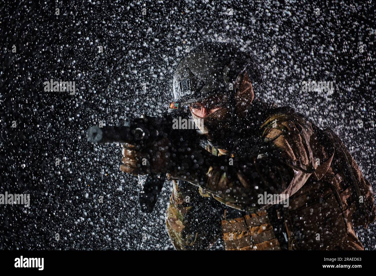 Army soldier in Combat Uniforms with an assault rifle, plate carrier ...