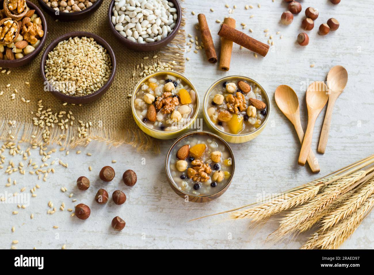 Traditional Turkish Dessert Ashure or Noah's Pudding in bamboo bowls on ...