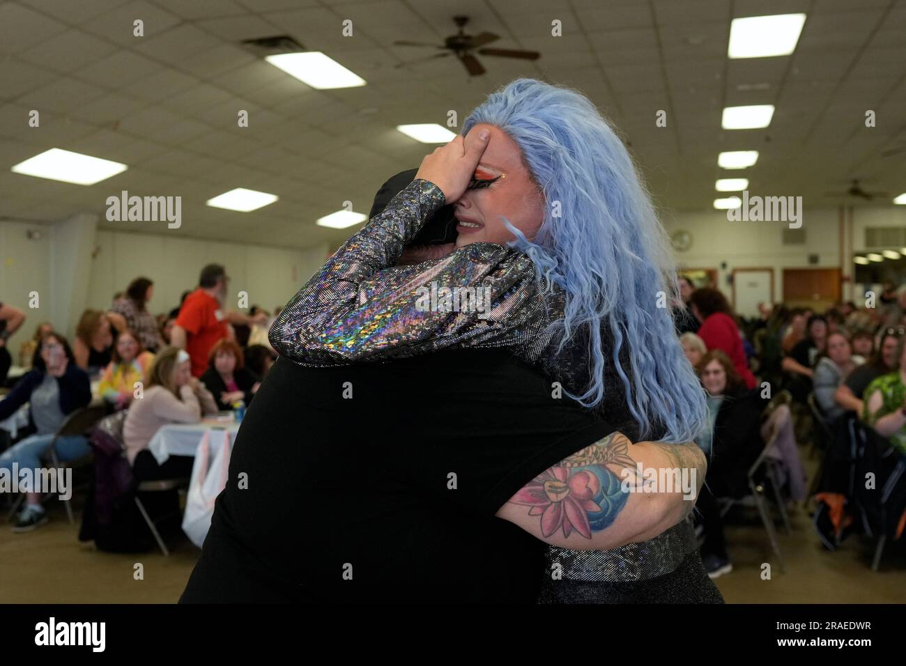 Drag queen Trixy Valentine, aka Jacob Kelley, cries in the arms of DJ ...