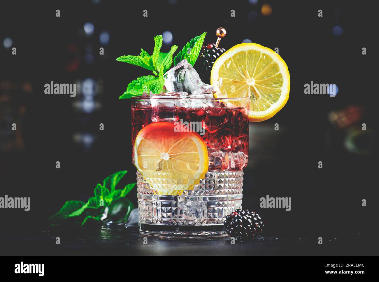 Bramble alcohol cocktail drink with dry gin, liqueur, syrup, lemon ...