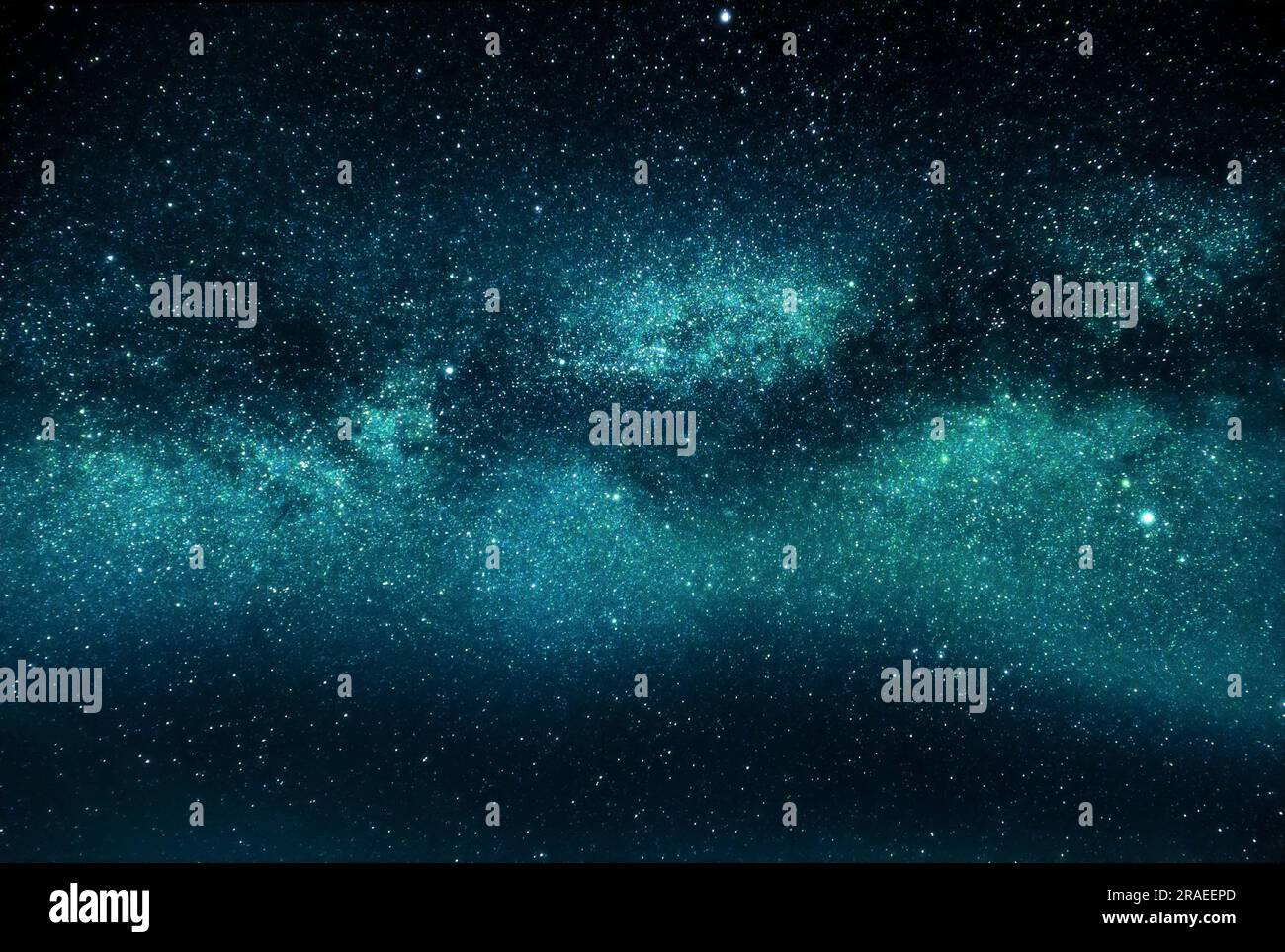The Milky Way galaxy core in a glowing blue light with lots of stars ...