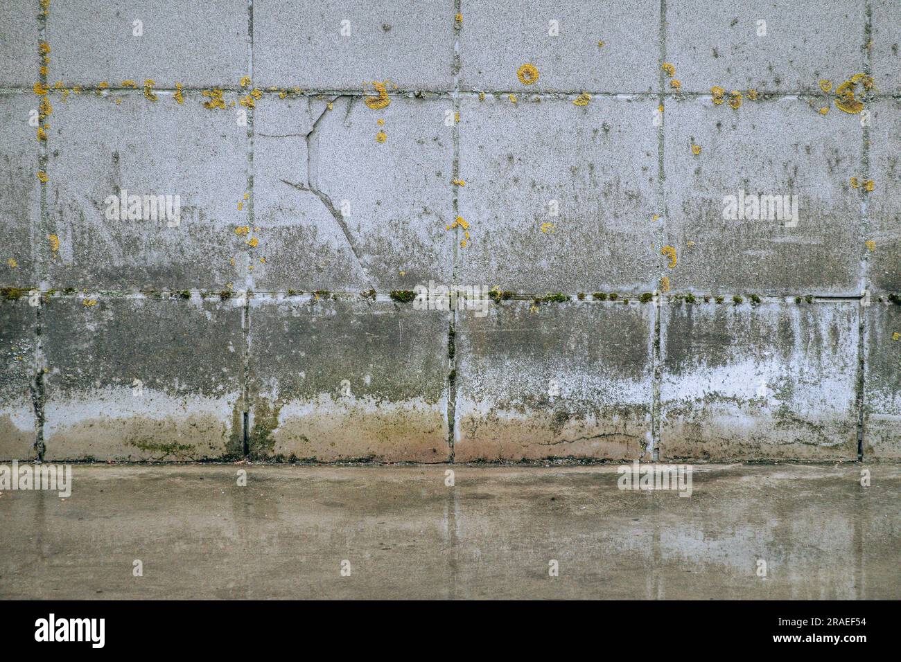 Damage caused by water leakage on building wall outside. Rainwater runs ...