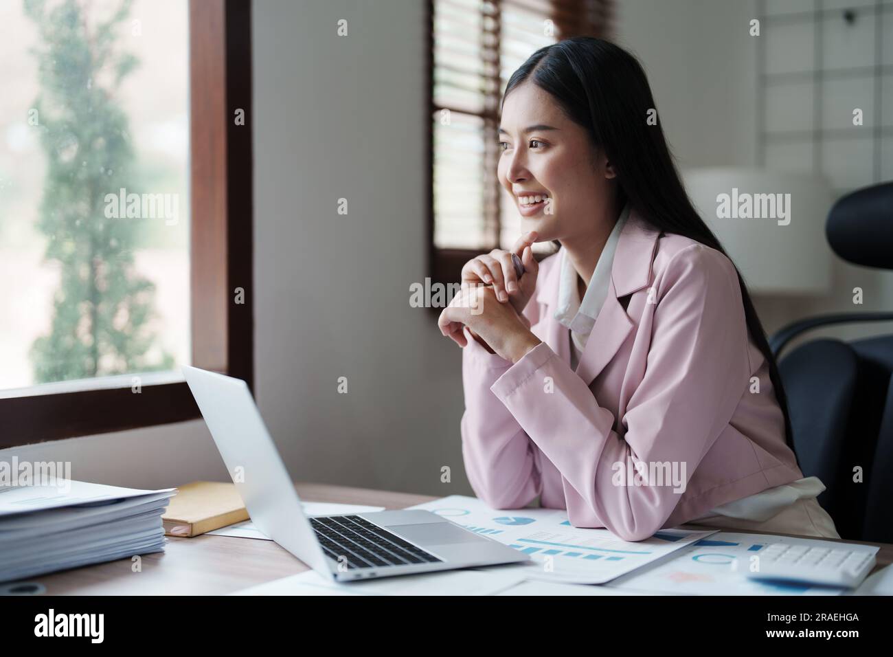 Portrait of a woman business owner showing a happy smiling face as he ...