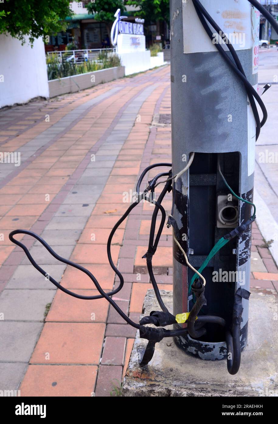 Unsafe electrical wiring or wires or cables taped together sticking out ...