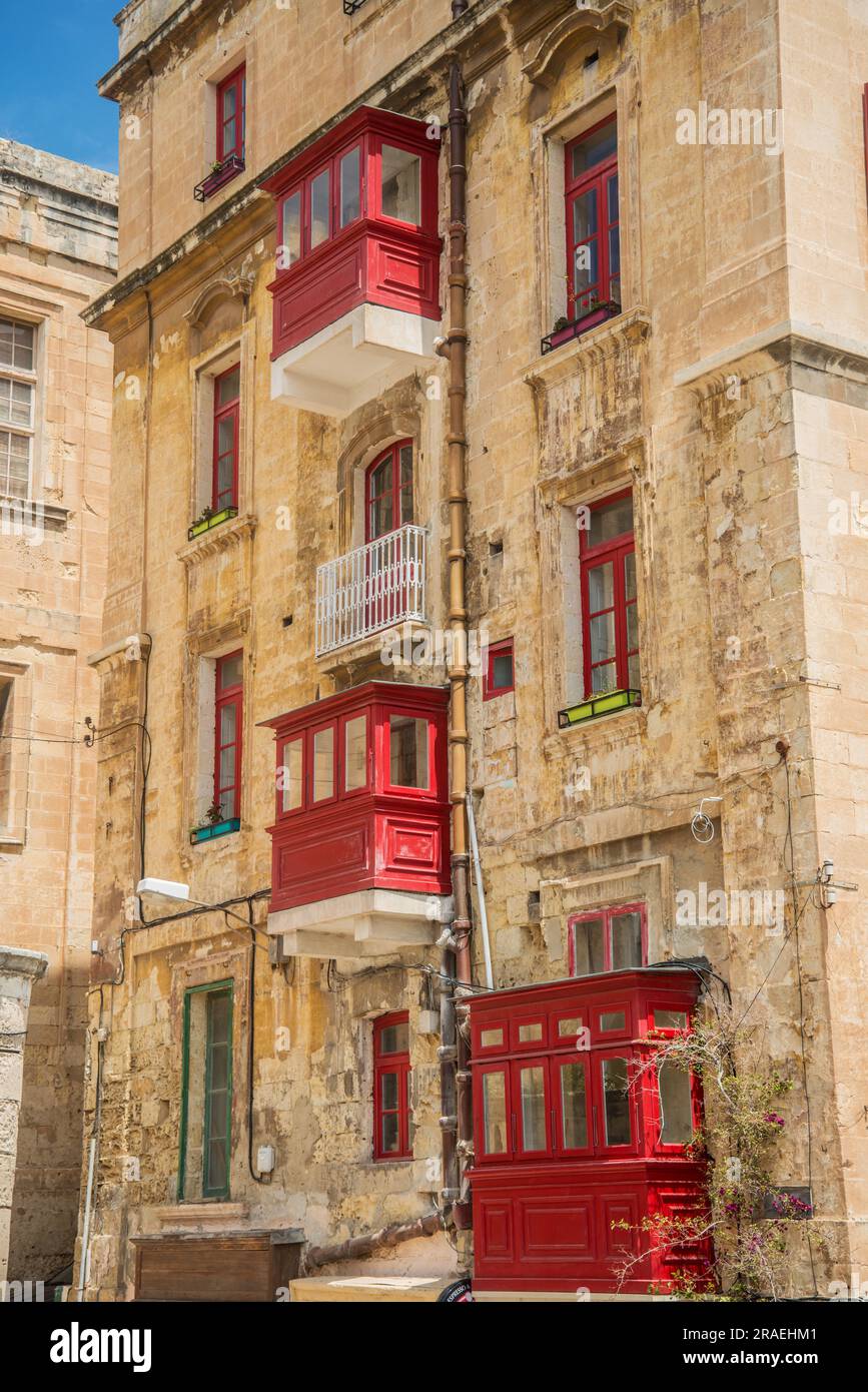 Historic building with traditional oriel windows in Valletta, Malta ...