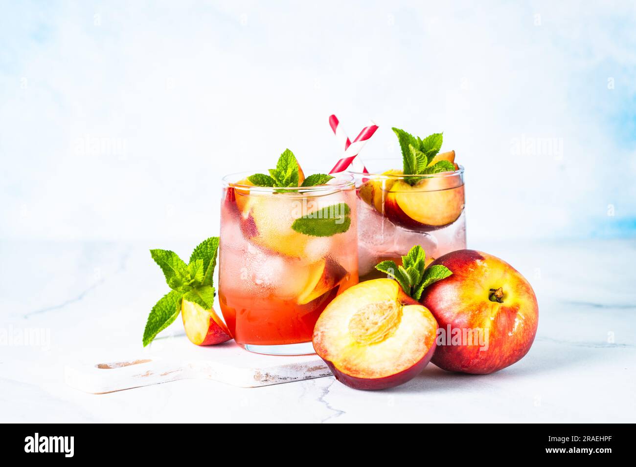 Peach cocktail, iced peach tea, fruit drink Stock Photo - Alamy