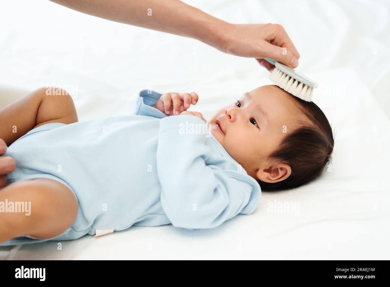 Young japanese woman combing her hair hi-res stock photography and ...