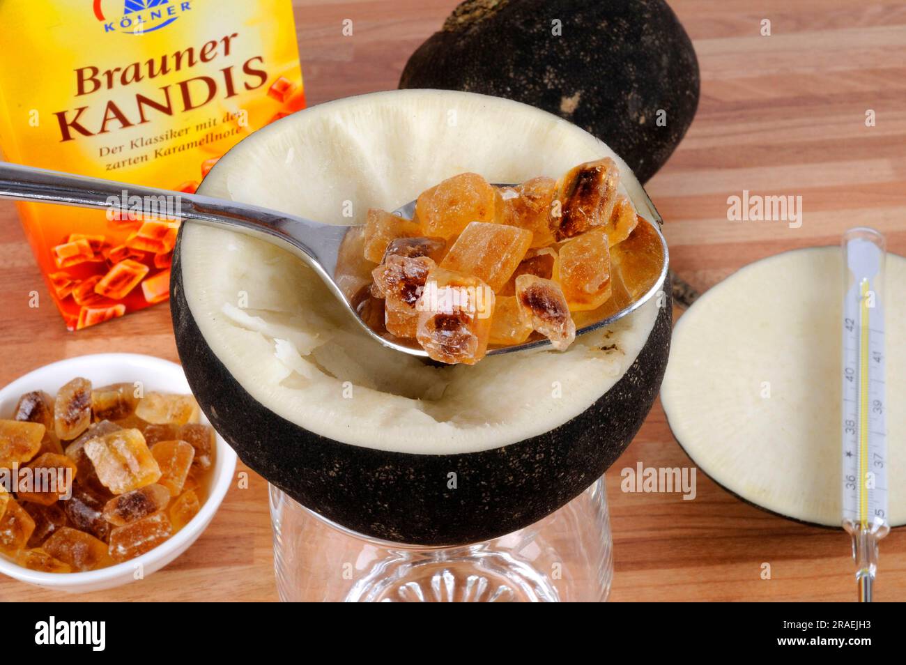 Black radish, root, and brown candy (Raphanus sativus), sugar ...