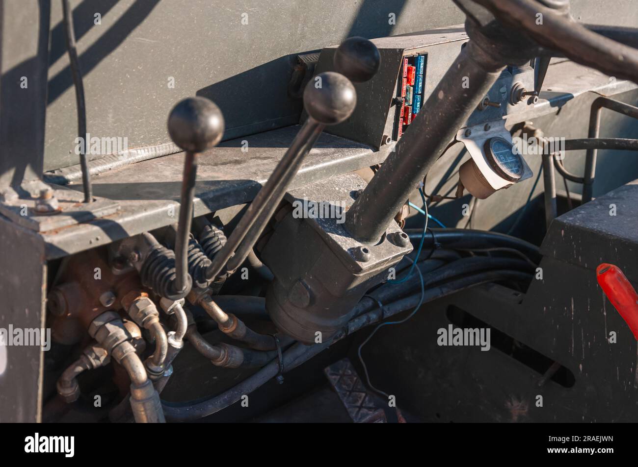 Detail of the interior of an old tractor in an industrial environment ...