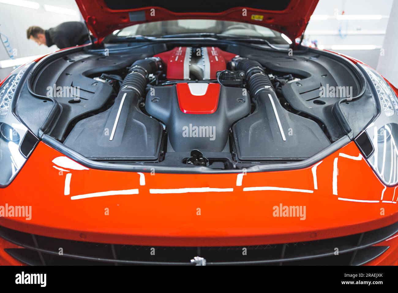 Front view of a clean shiny red sports car engine under the hood. Car ...