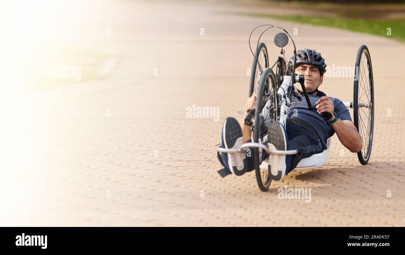 Man with disability, handbike and outdoor bicycle for sports, race or ...