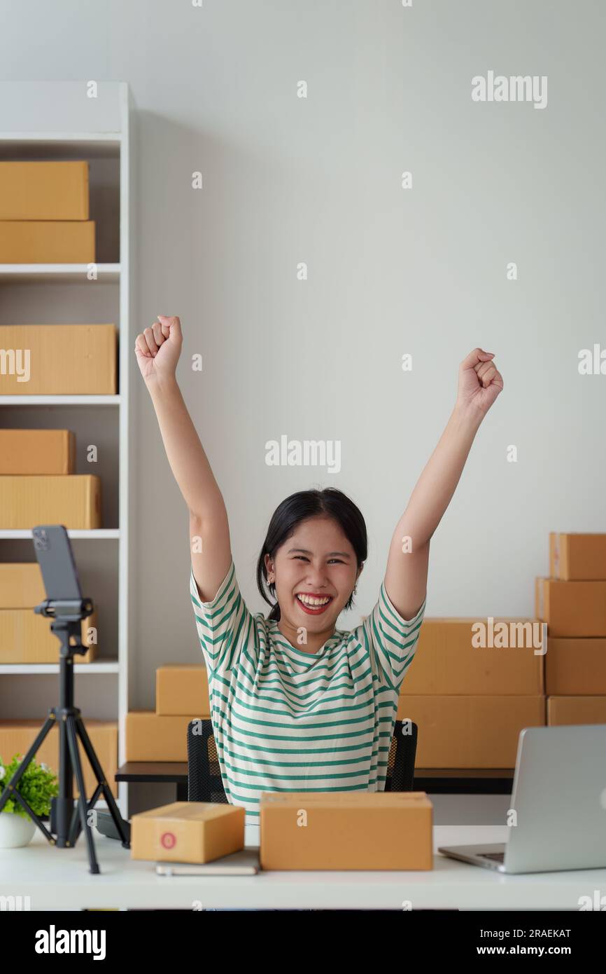 Successful SME entrepreneur. Asian woman working on receipt box and ...