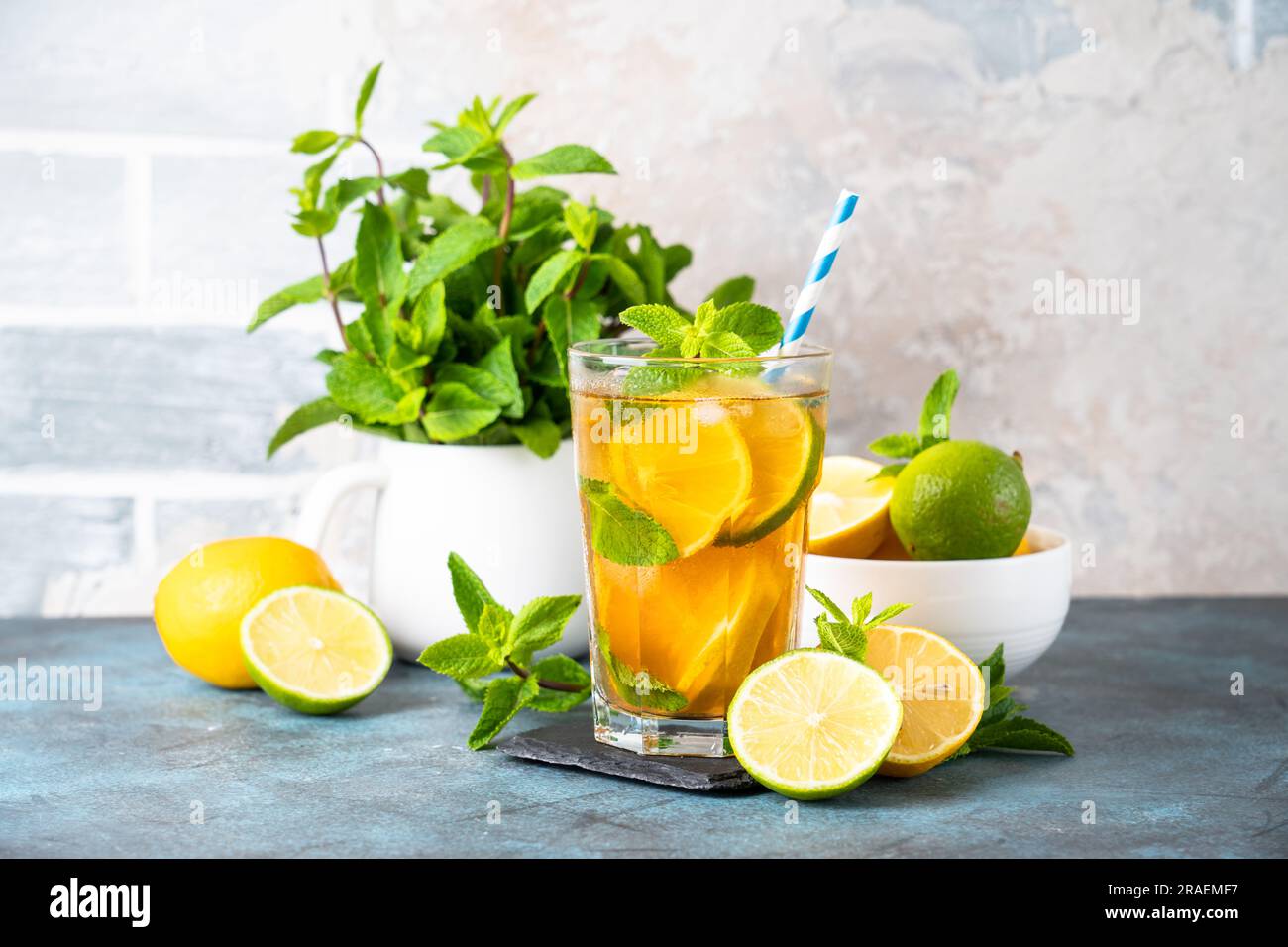 Iced tea. Summer drink with lemon, lime, mint and ice. Cold lemonade ...