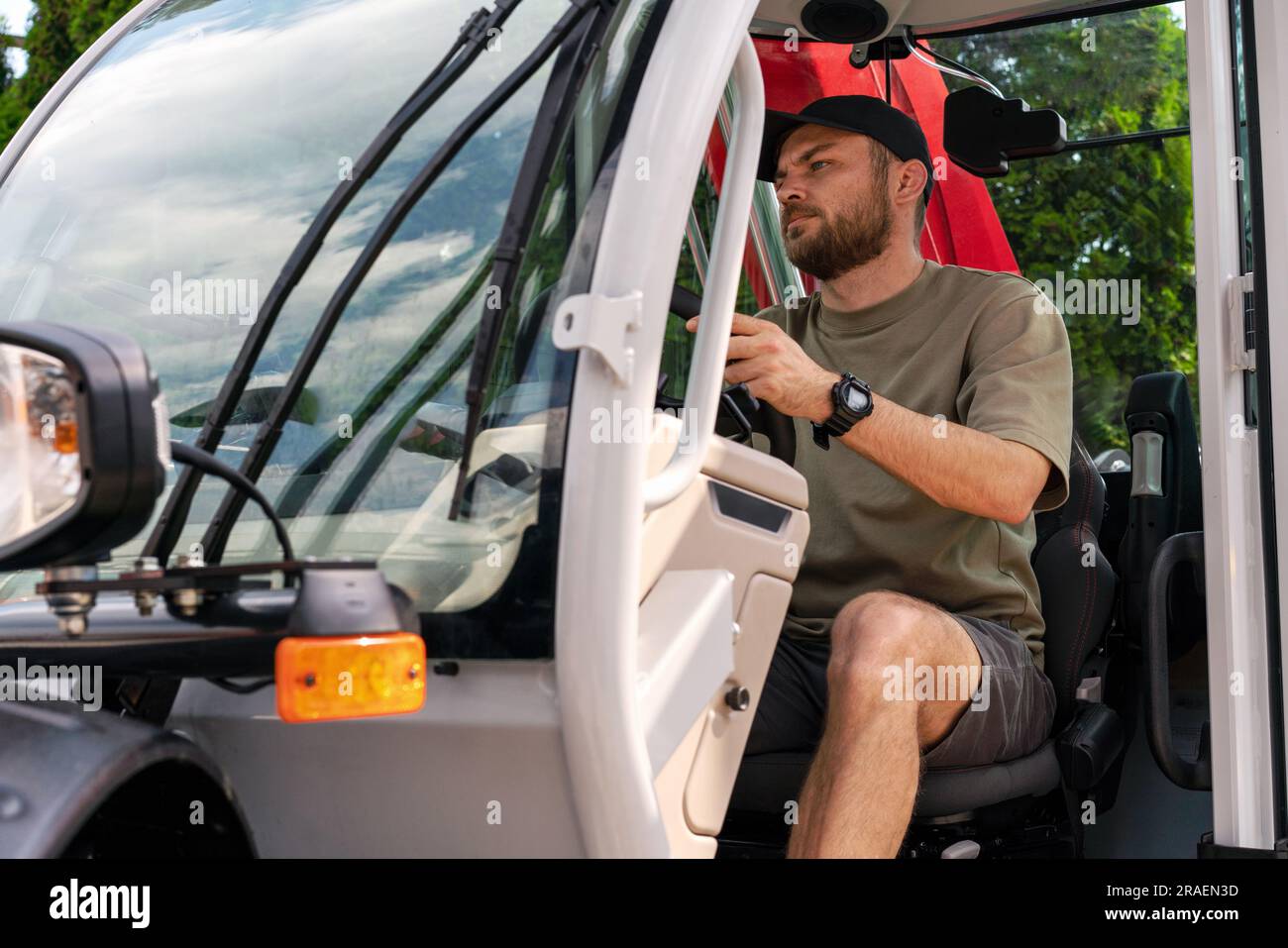 Man worker is operating the agri farmer rotating telescopic handler ...