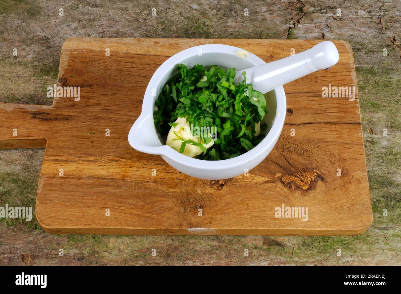 Preparation of herb butter, ingredients garlic rue, chives, wild garlic ...