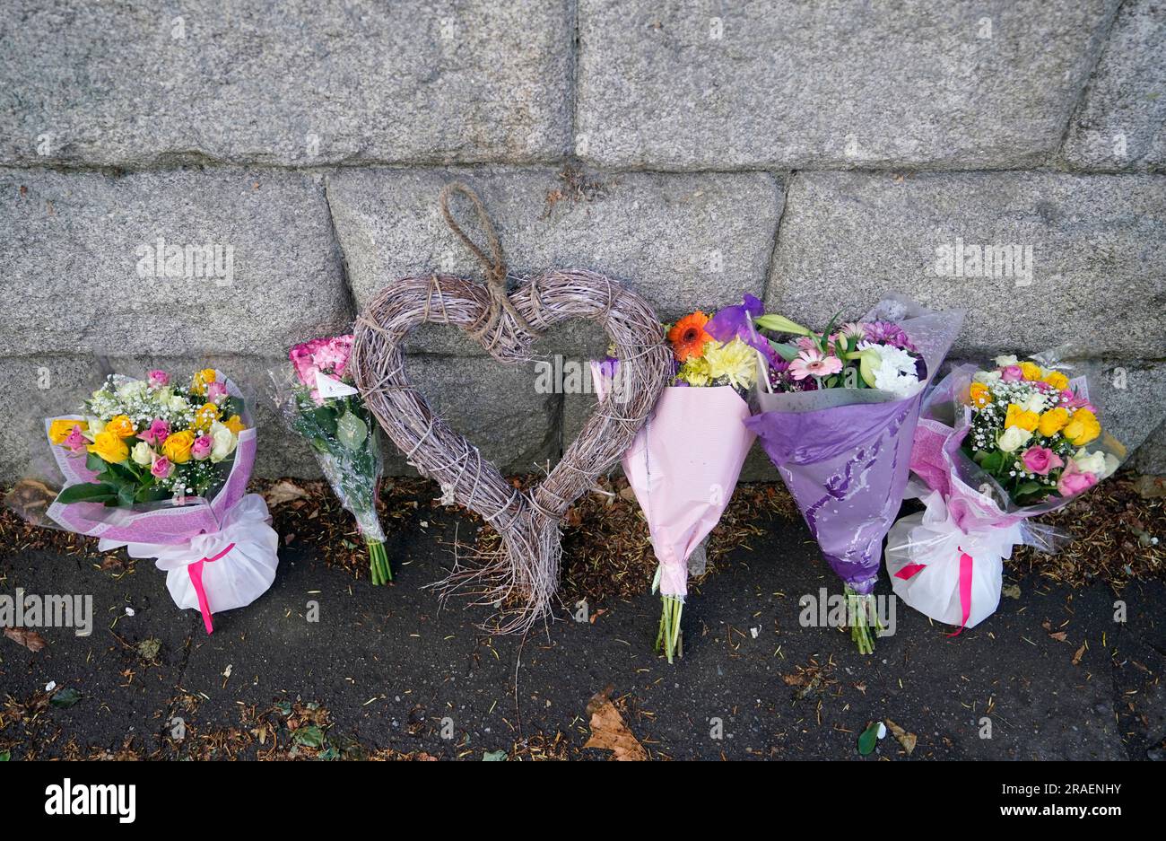 Flowers outside St, Michael's College in Dublin, Ireland, after the ...