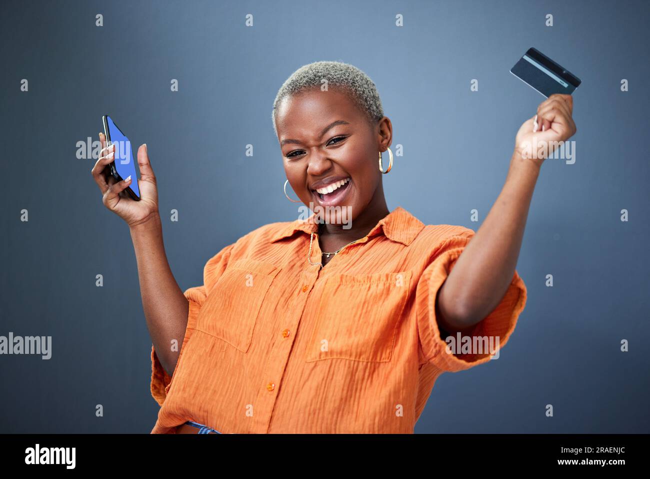 Winner, phone and credit card with a black woman online shopping in ...