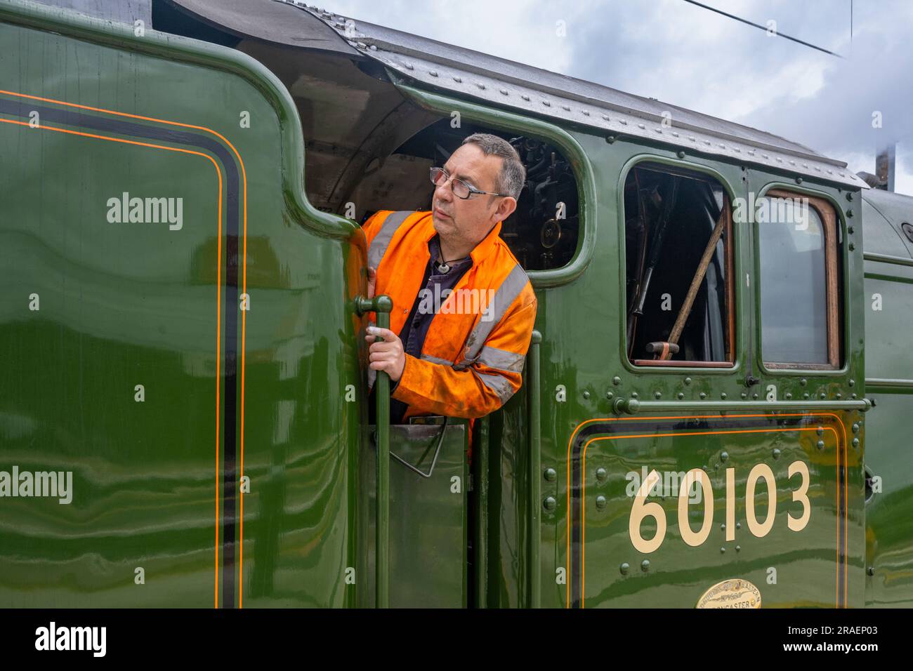 Portrait of the engine driver of The Flying Scotsman steam train in ...