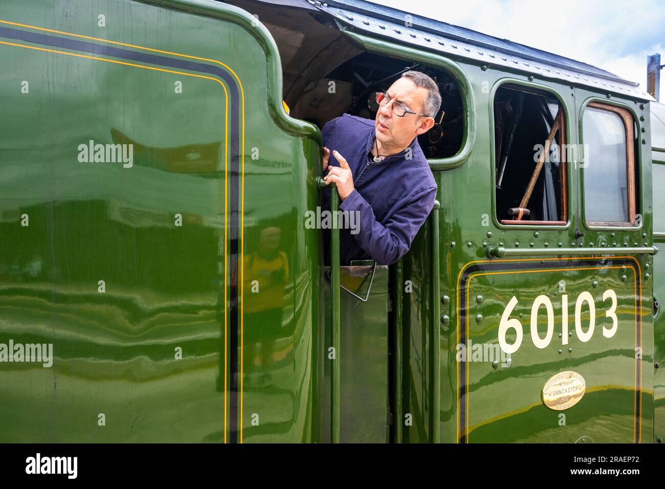 Portrait of the engine driver of The Flying Scotsman steam train in ...