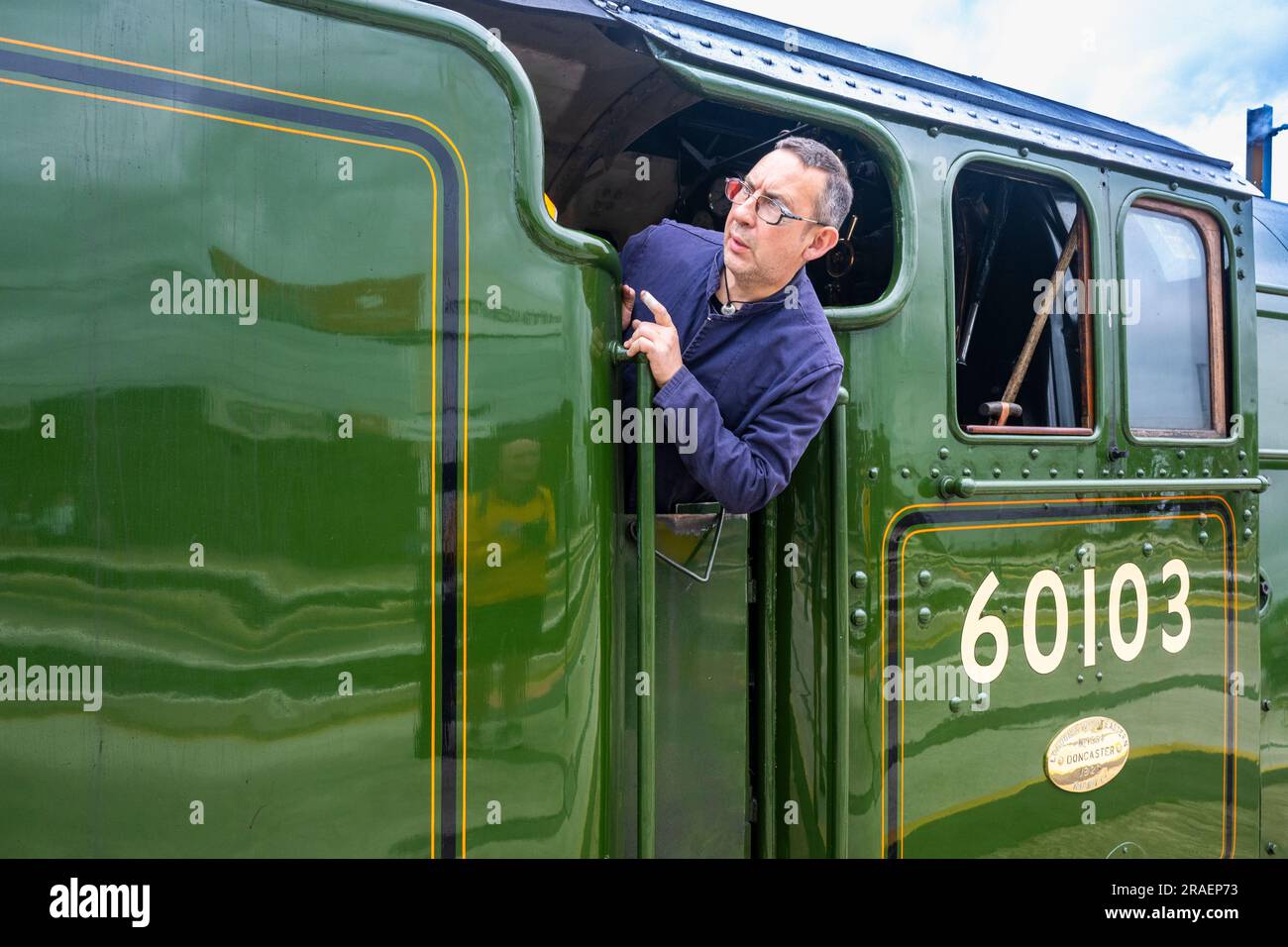 Portrait of the engine driver of The Flying Scotsman steam train in ...