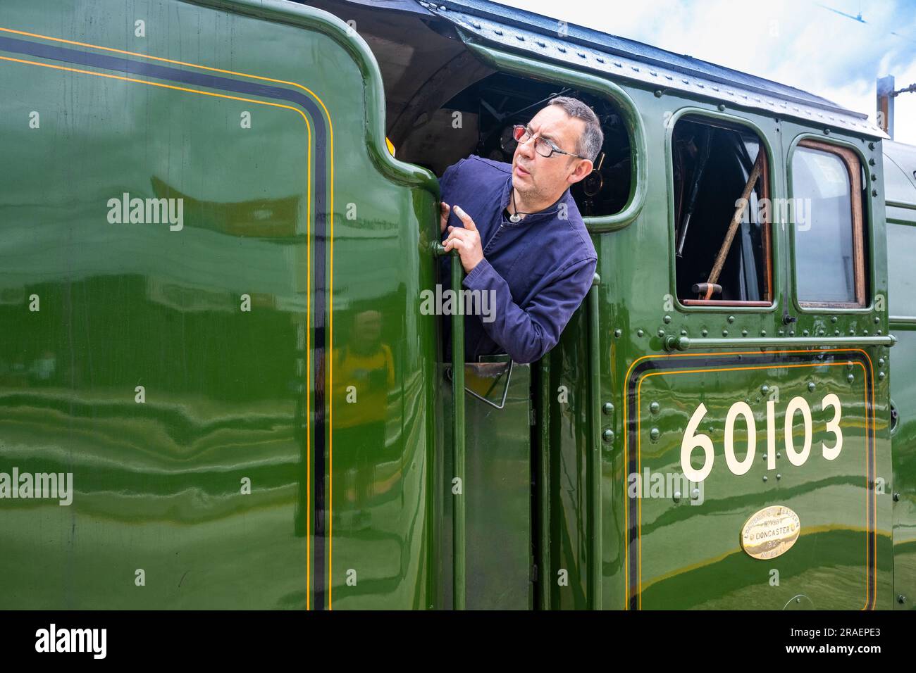Portrait of the engine driver of The Flying Scotsman steam train in ...