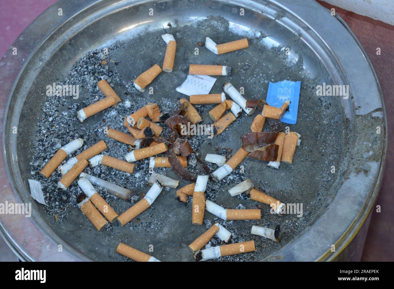 Tray with cigarette in the ashtray Stock Photo - Alamy