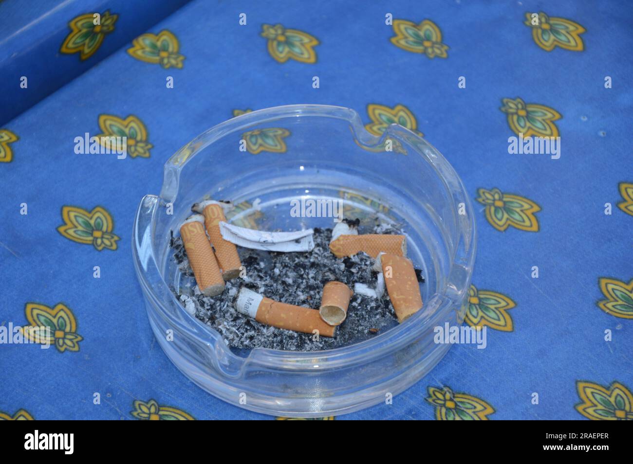 Tray with cigarette in the ashtray Stock Photo - Alamy
