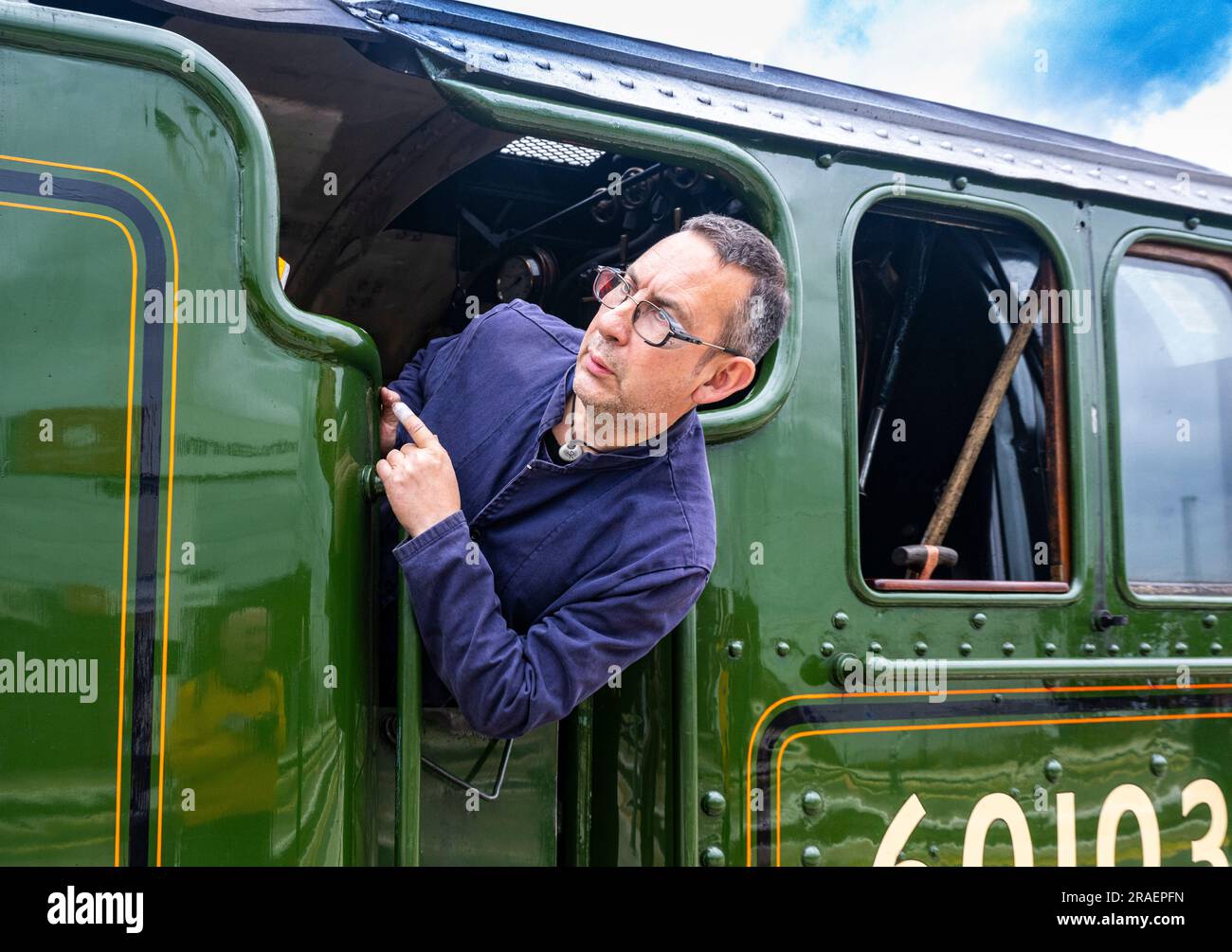 Portrait of the engine driver of The Flying Scotsman steam train in ...