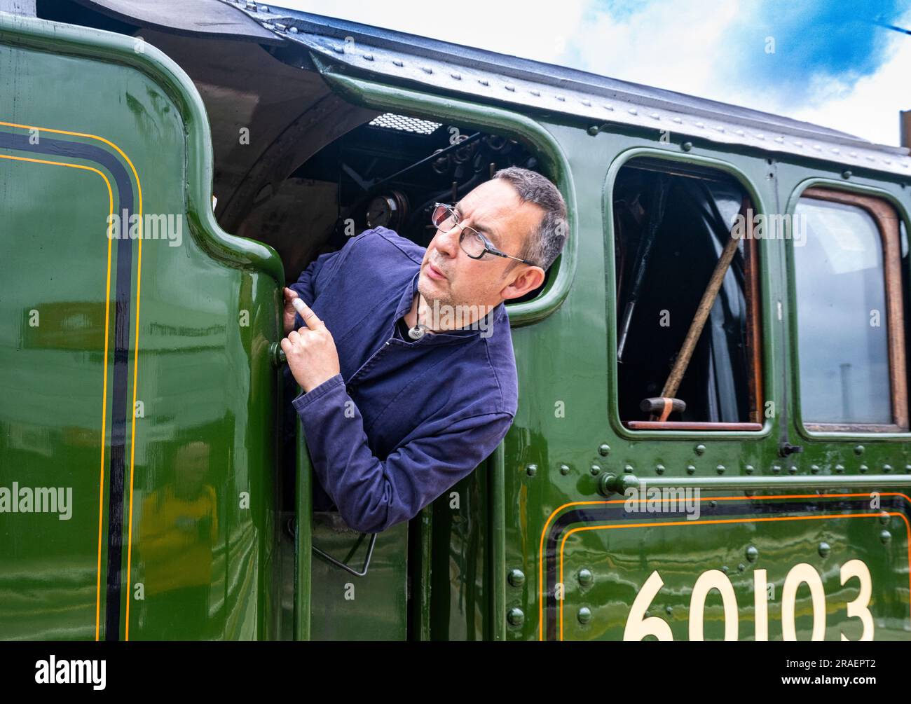 Portrait of the engine driver of The Flying Scotsman steam train in ...