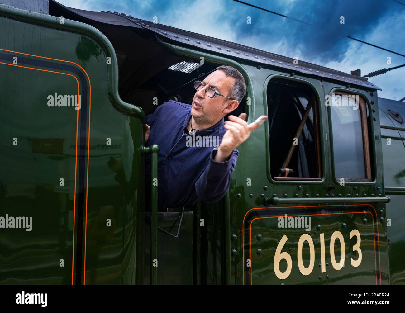 Portrait of the engine driver of The Flying Scotsman steam train in ...