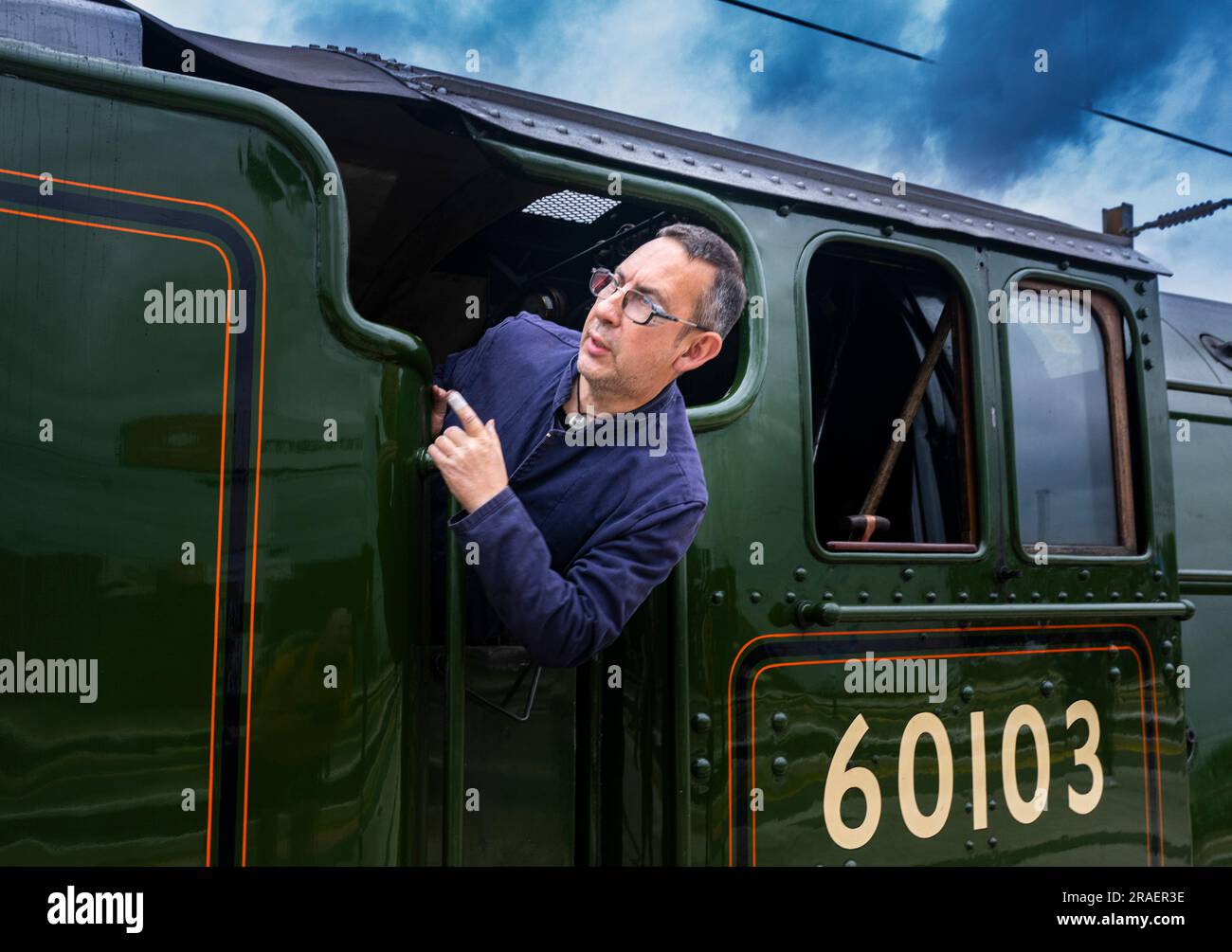 Portrait of the engine driver of The Flying Scotsman steam train in ...