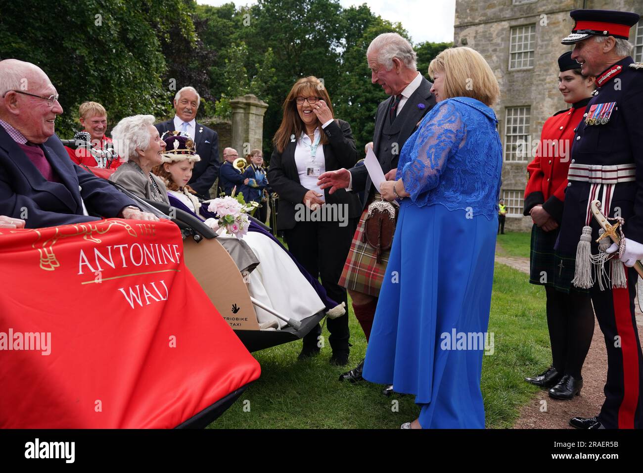 King Charles III (centre right) during his visit to Kinneil House in ...