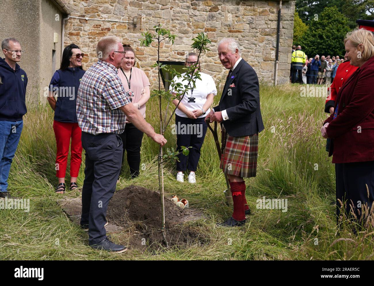 King Charles III (right) plants a tree to commemorate the centenary of ...