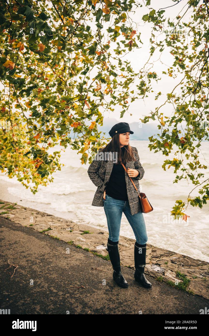 Outdoor full body fashion portrait of young beautiful fashionable woman ...