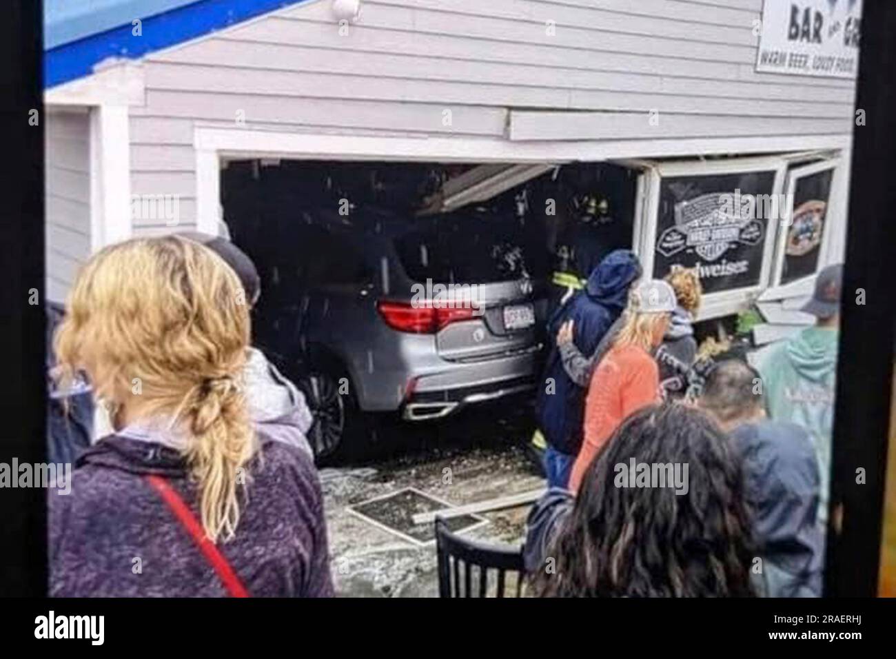 In this photo released by the Laconia Fire Department, a vehicle sits ...