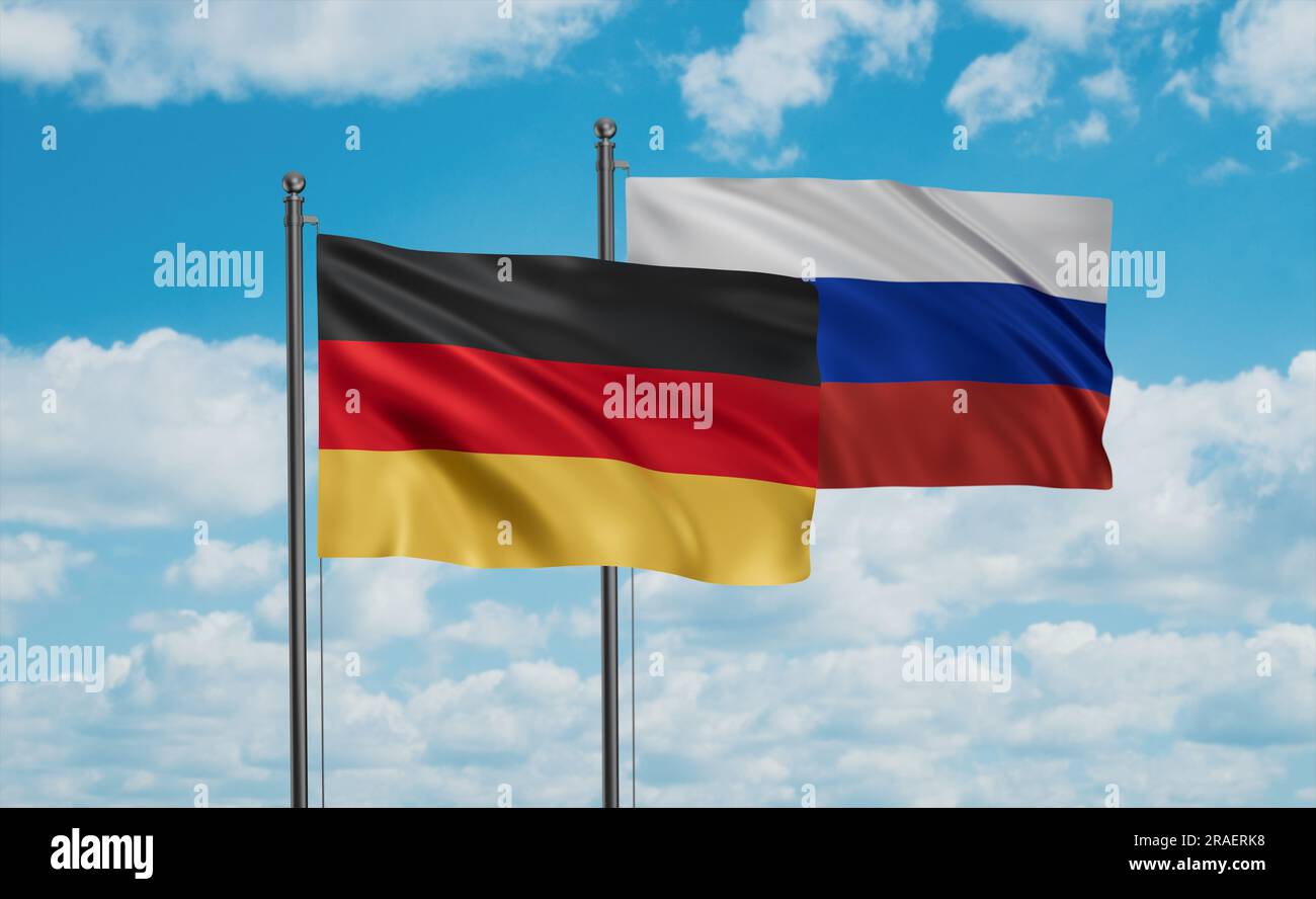 Russian Federation and Germany flag waving together in the wind on blue ...