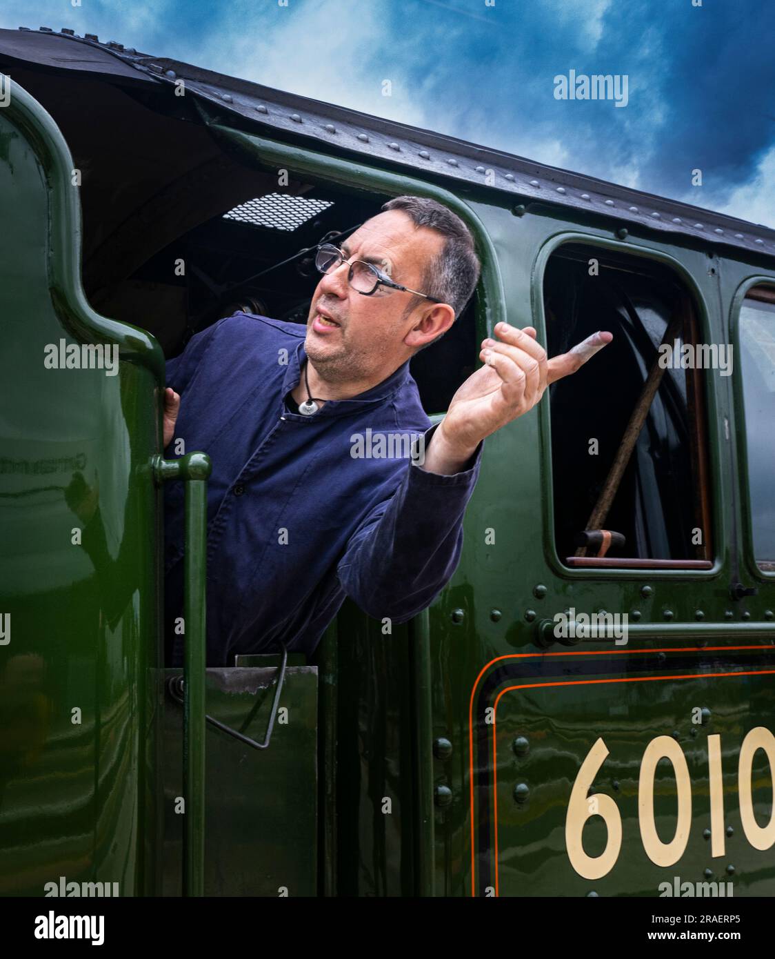 Portrait of the engine driver of The Flying Scotsman steam train in ...