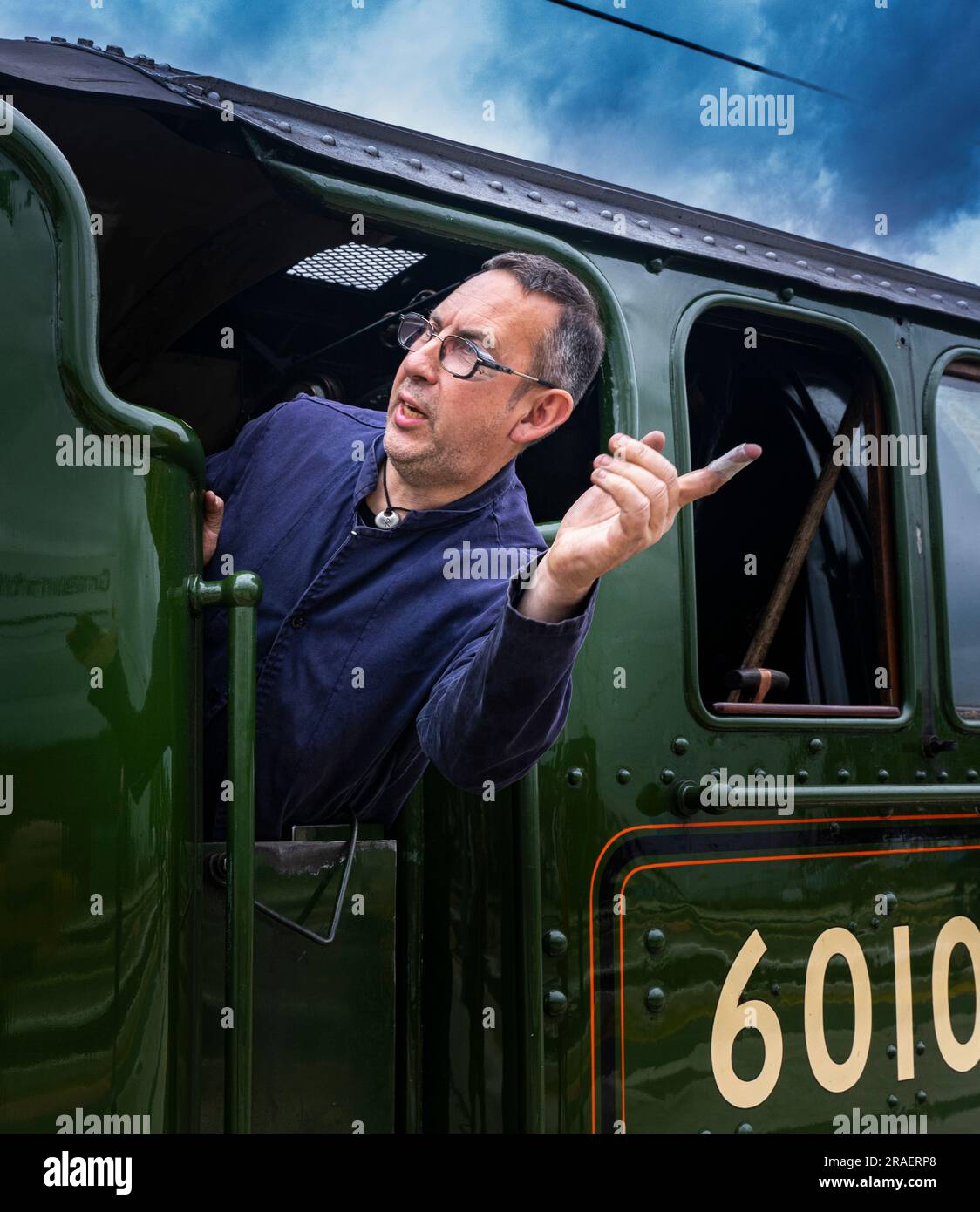 Portrait of the engine driver of The Flying Scotsman steam train in ...