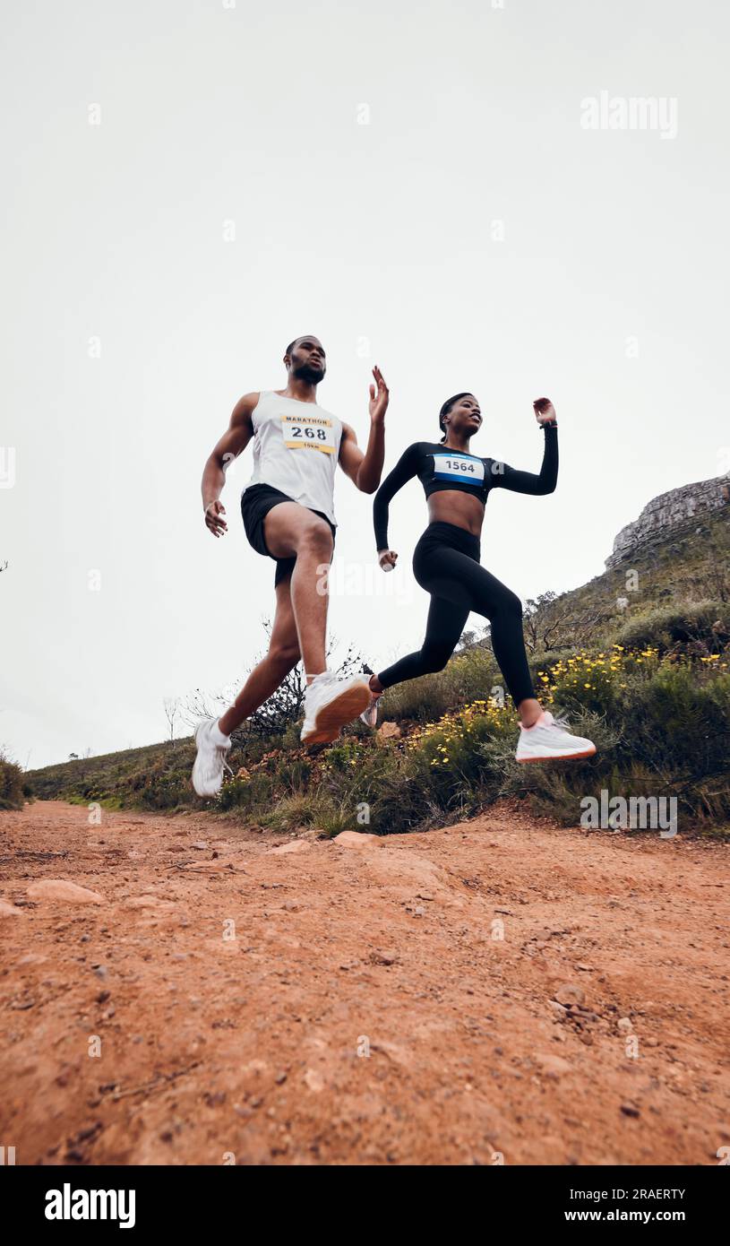 Running, jump and couple in mountain with fitness workout and training ...