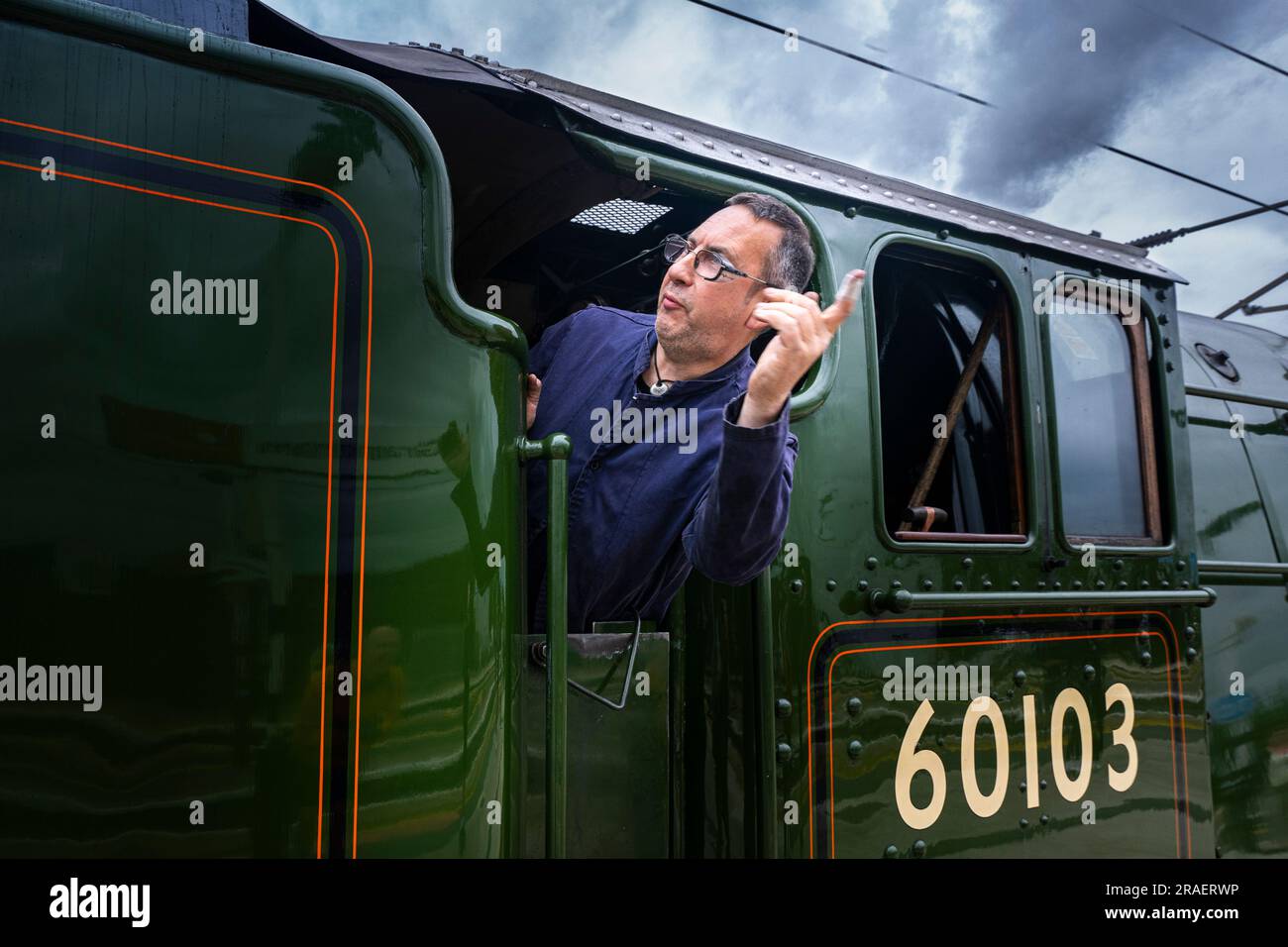 Portrait of the engine driver of The Flying Scotsman steam train in ...