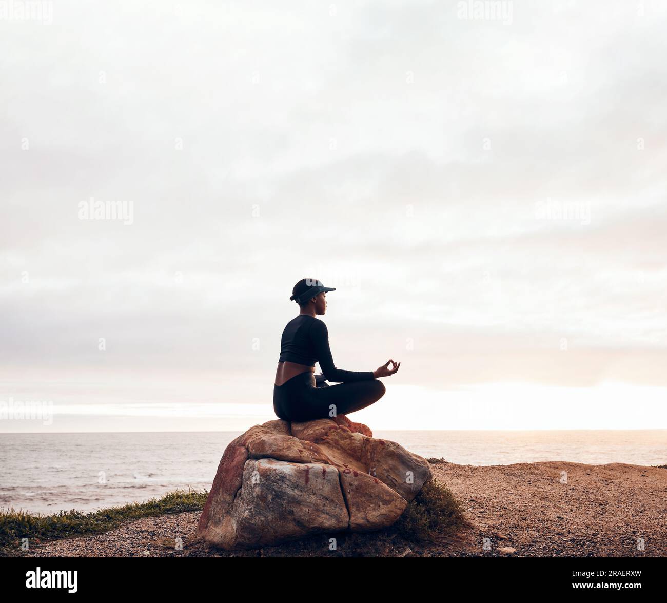 Lotus pose, woman and yoga at the beach, fitness and meditation with ...