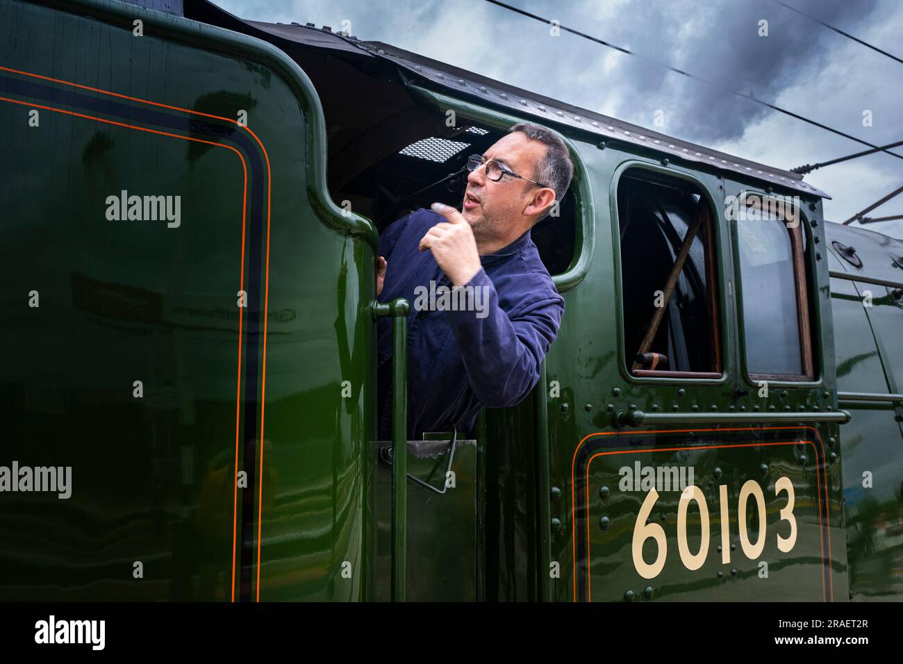 Portrait of the engine driver of The Flying Scotsman steam train in ...