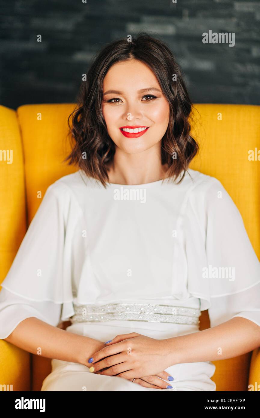 Fashion Portrait Of Beautiful Young Asian Woman Wearing White Dress