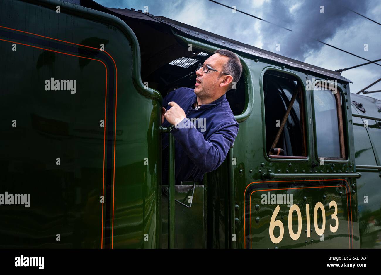 Portrait of the engine driver of The Flying Scotsman steam train in ...