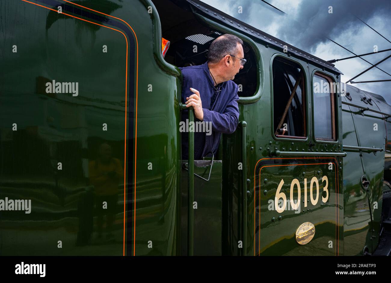 Portrait of the engine driver of The Flying Scotsman steam train in ...