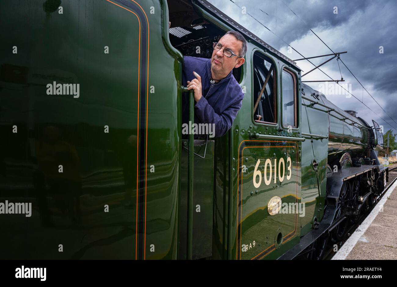 Portrait of the engine driver of The Flying Scotsman steam train in ...