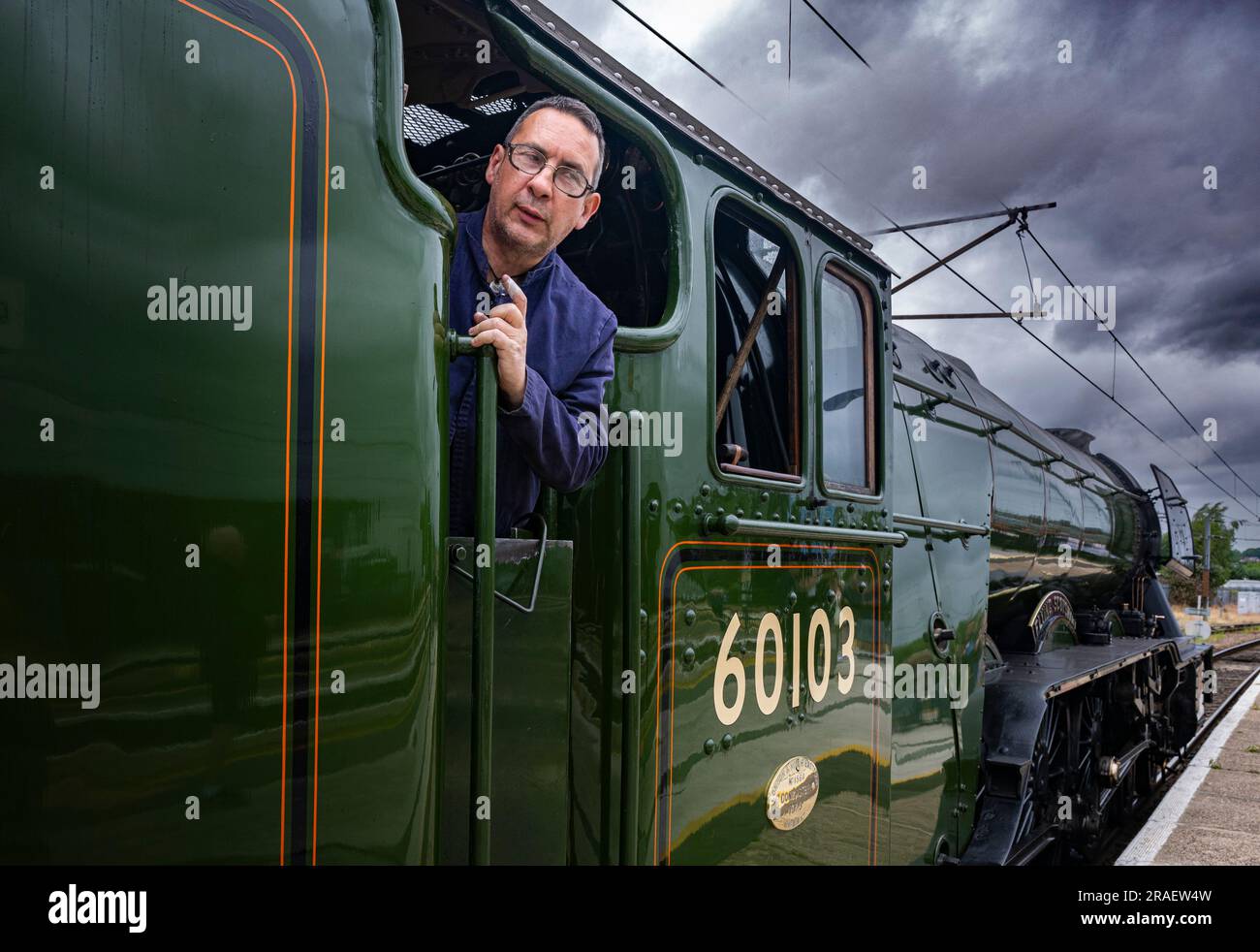 Portrait of the engine driver of The Flying Scotsman steam train in ...