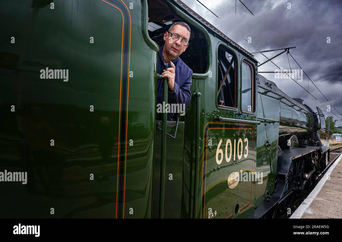 Portrait of the engine driver of The Flying Scotsman steam train in ...