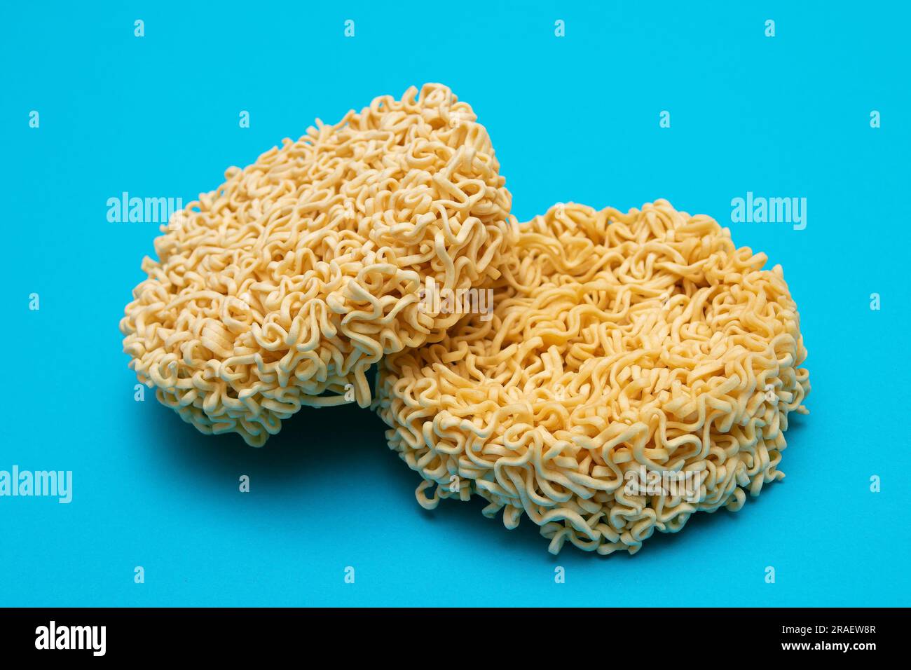 Uncooked Instant Noodles on Blue Background. Raw Pasta. Dry Asian Fast ...