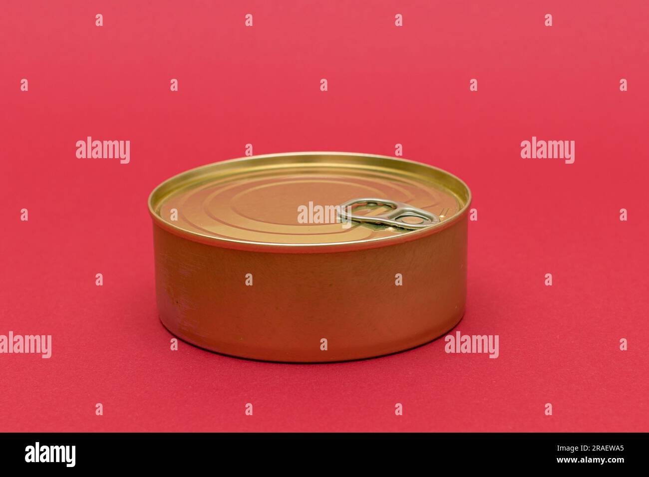 Unopened Tin Can with Blank Edge on Red Background. Canned Food ...